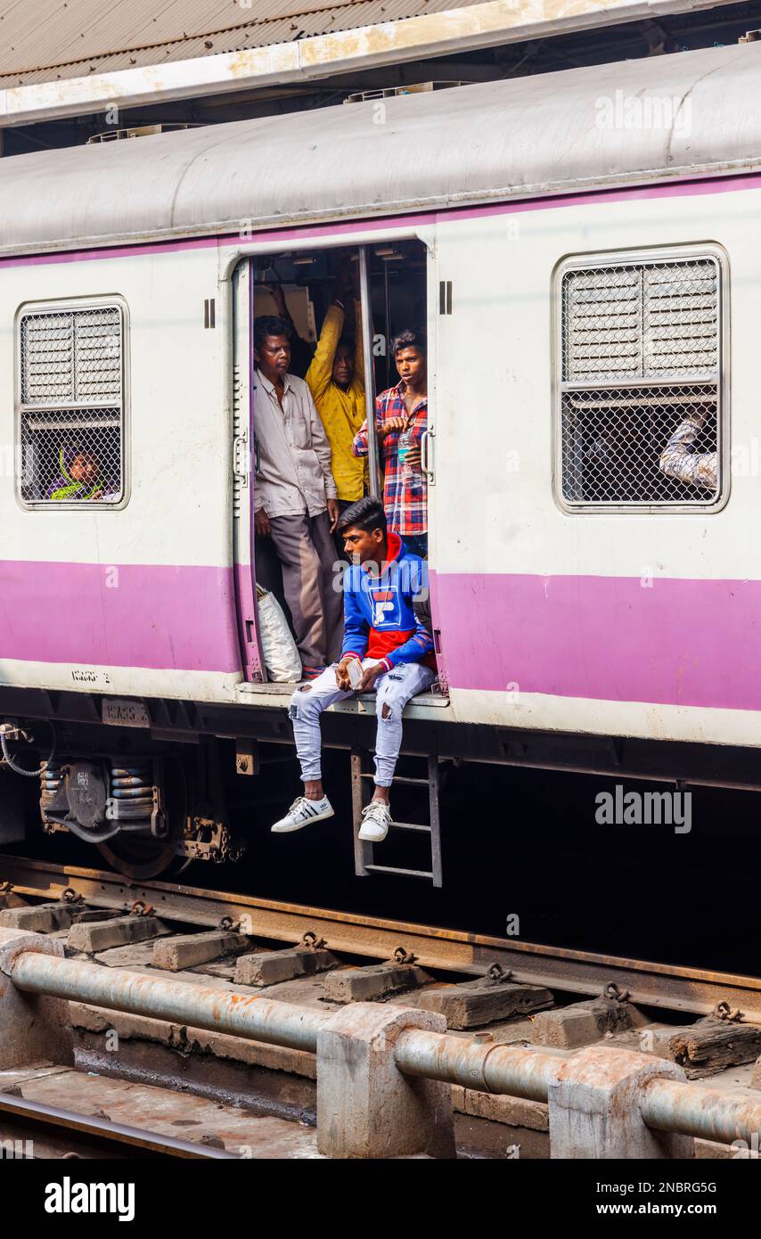 Passengers in an open doorway of a train railway carriage waiting to ... Passengers in an open doorway of a train railway carriage waiting to ...