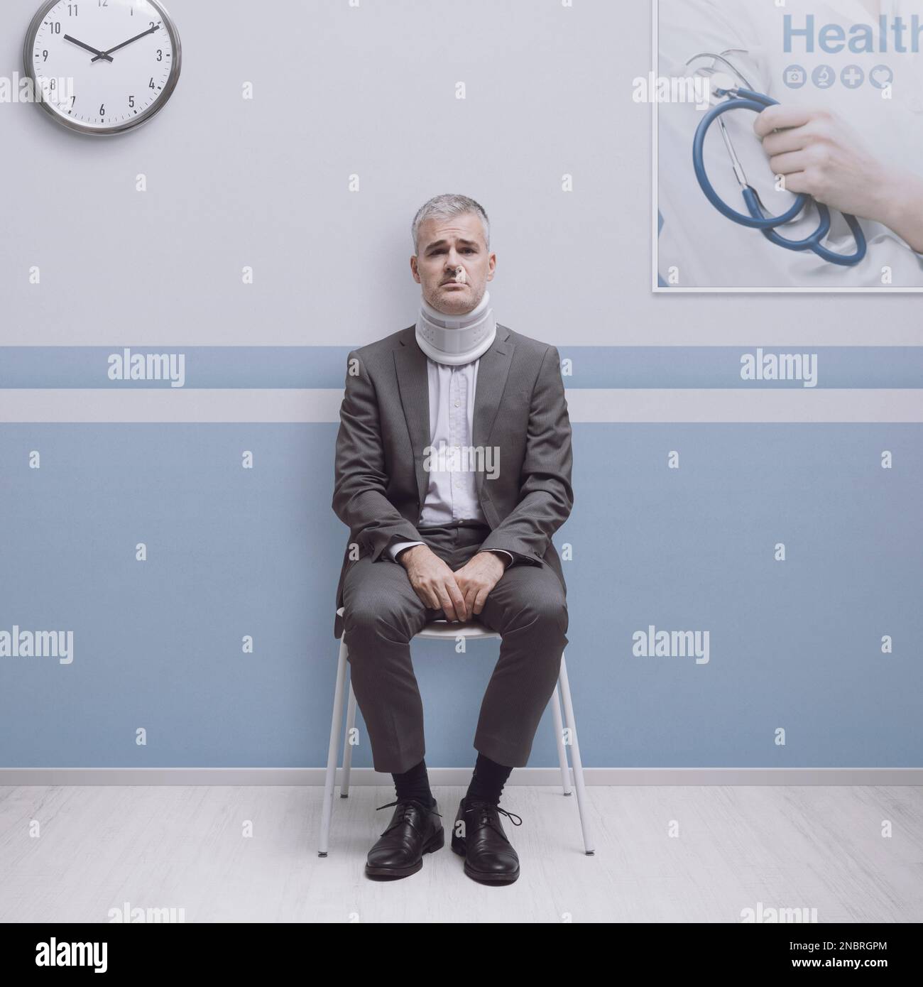 Injured patient sitting in the waiting room at the hospital: he is ...