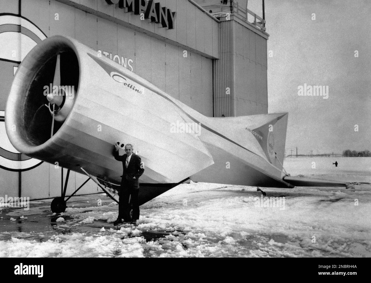 Aircraft designer Dr. Alexander Lippisch stands beside his latest ...