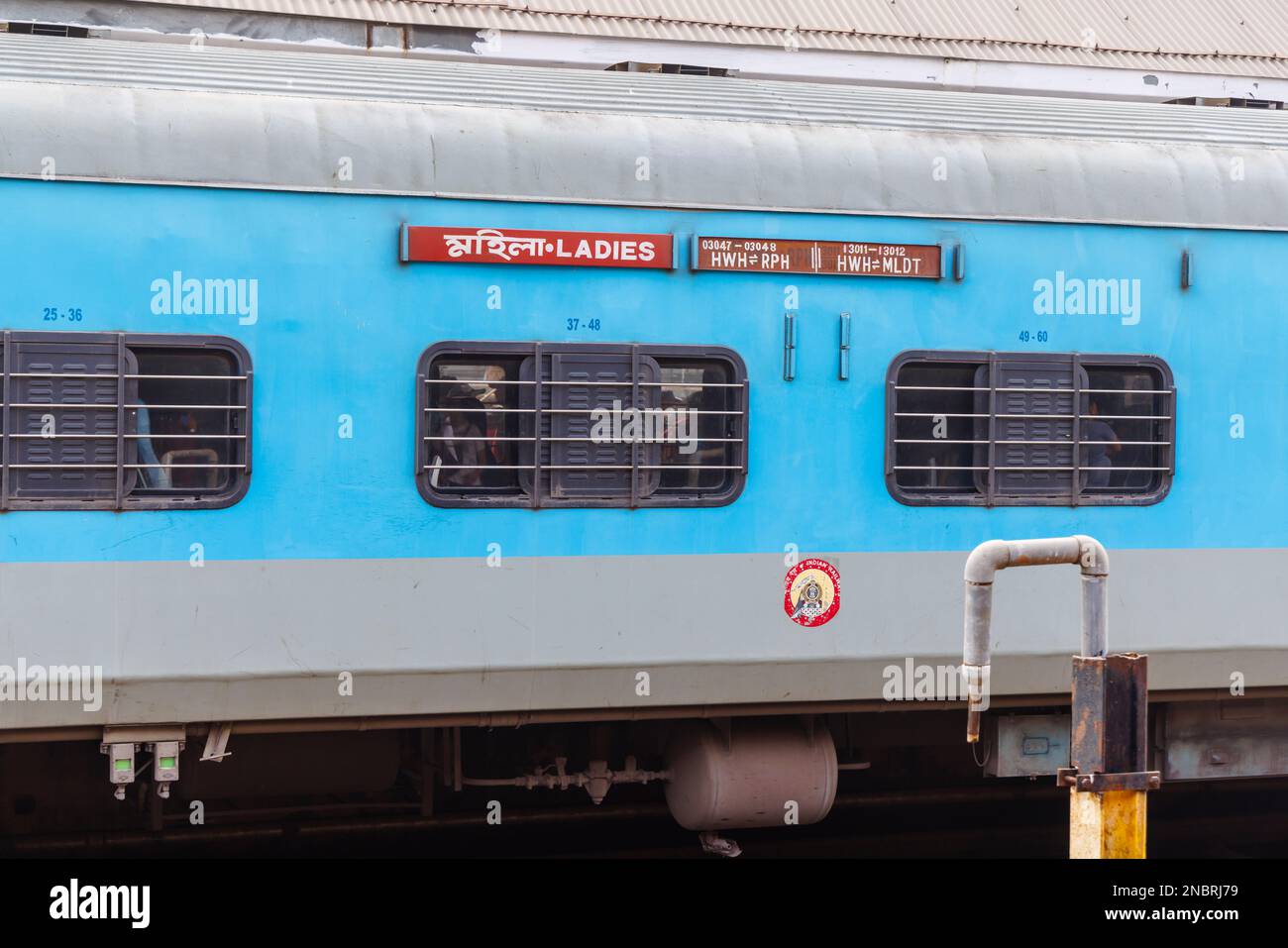 Ladies compartment sign on the exterior of a blue railway carriage car ...