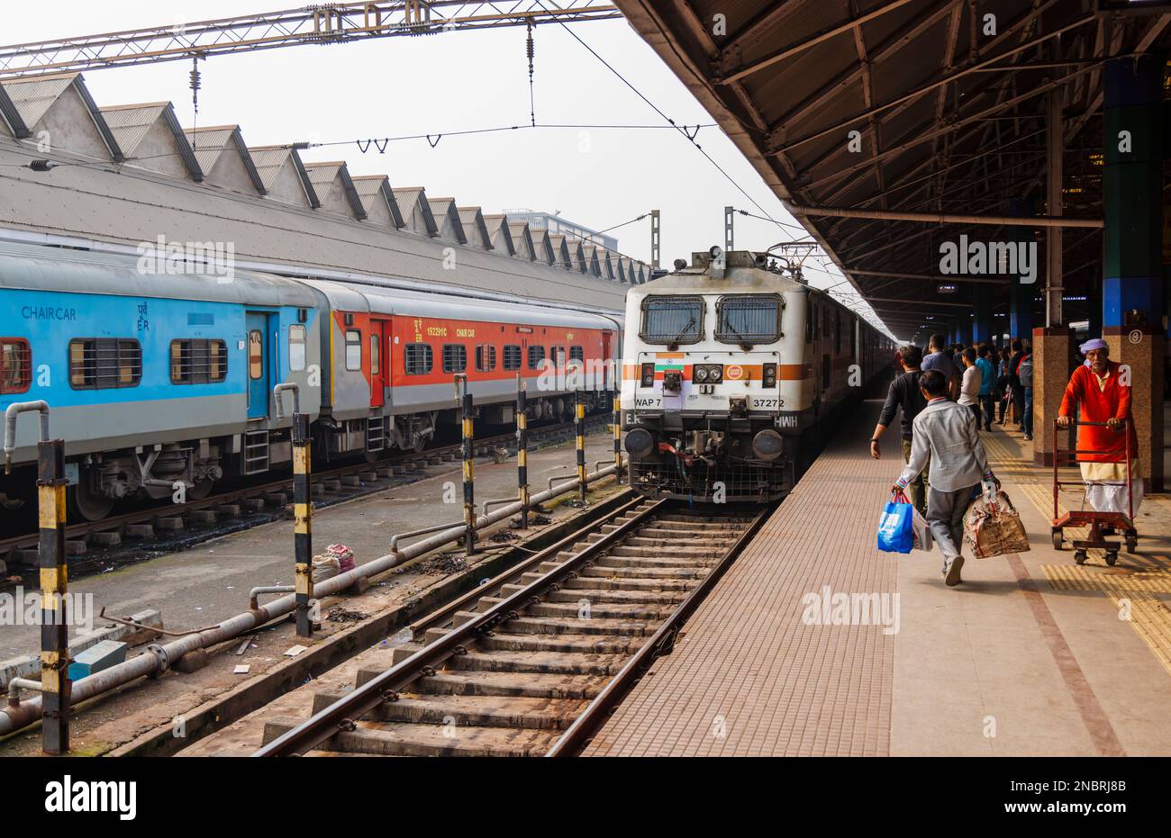 White Indian Railways train locomotive engine standing at a platform at ... White Indian Railways train locomotive engine standing at a platform at ...