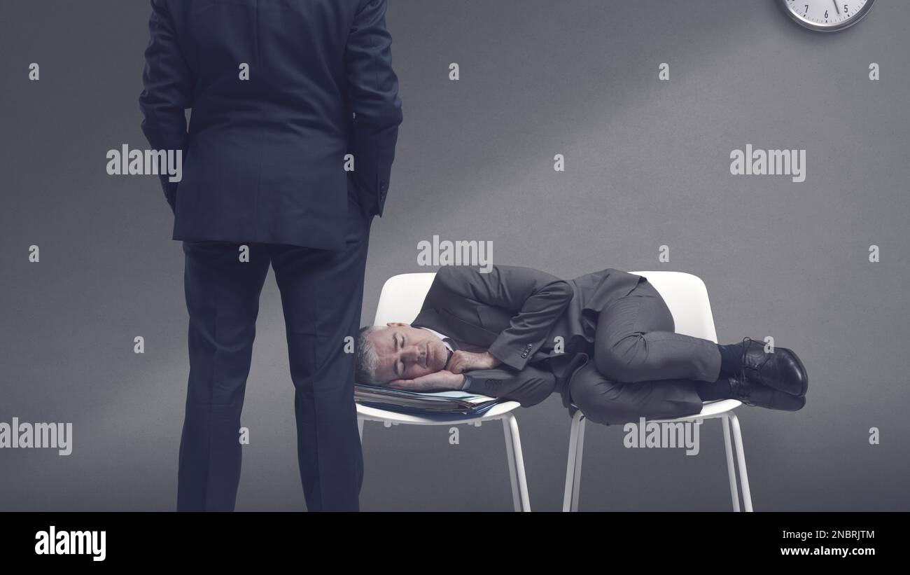 Exhausted lazy corporate businessman lying down on chairs and sleeping ...