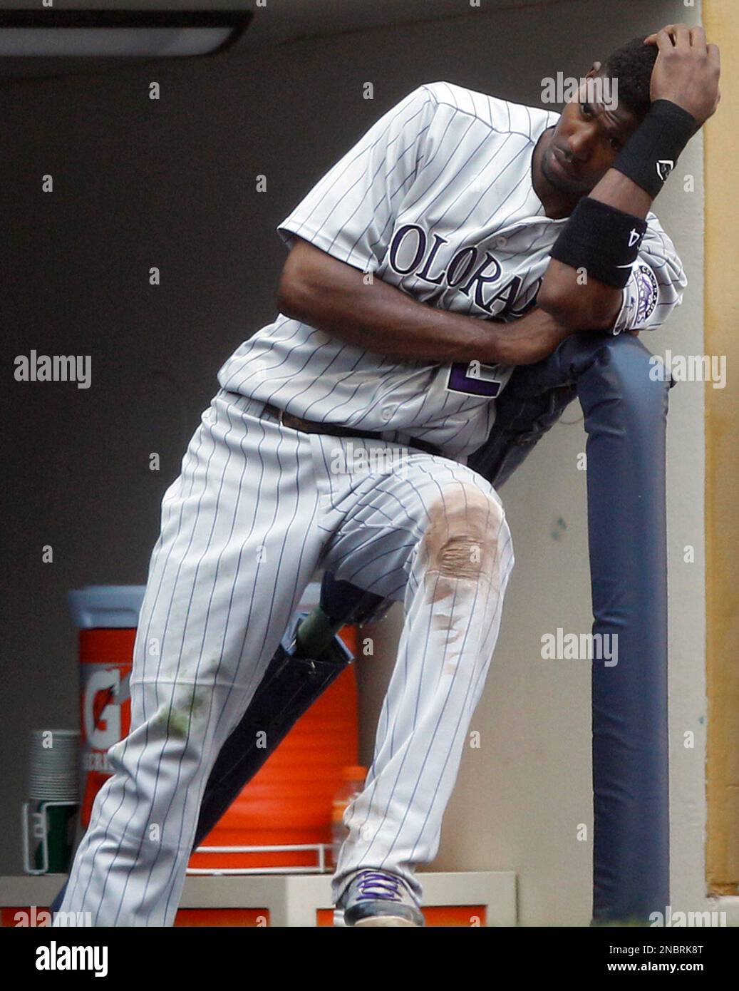Colorado Rockies' Dexter Fowler watches from the dugout during the ...