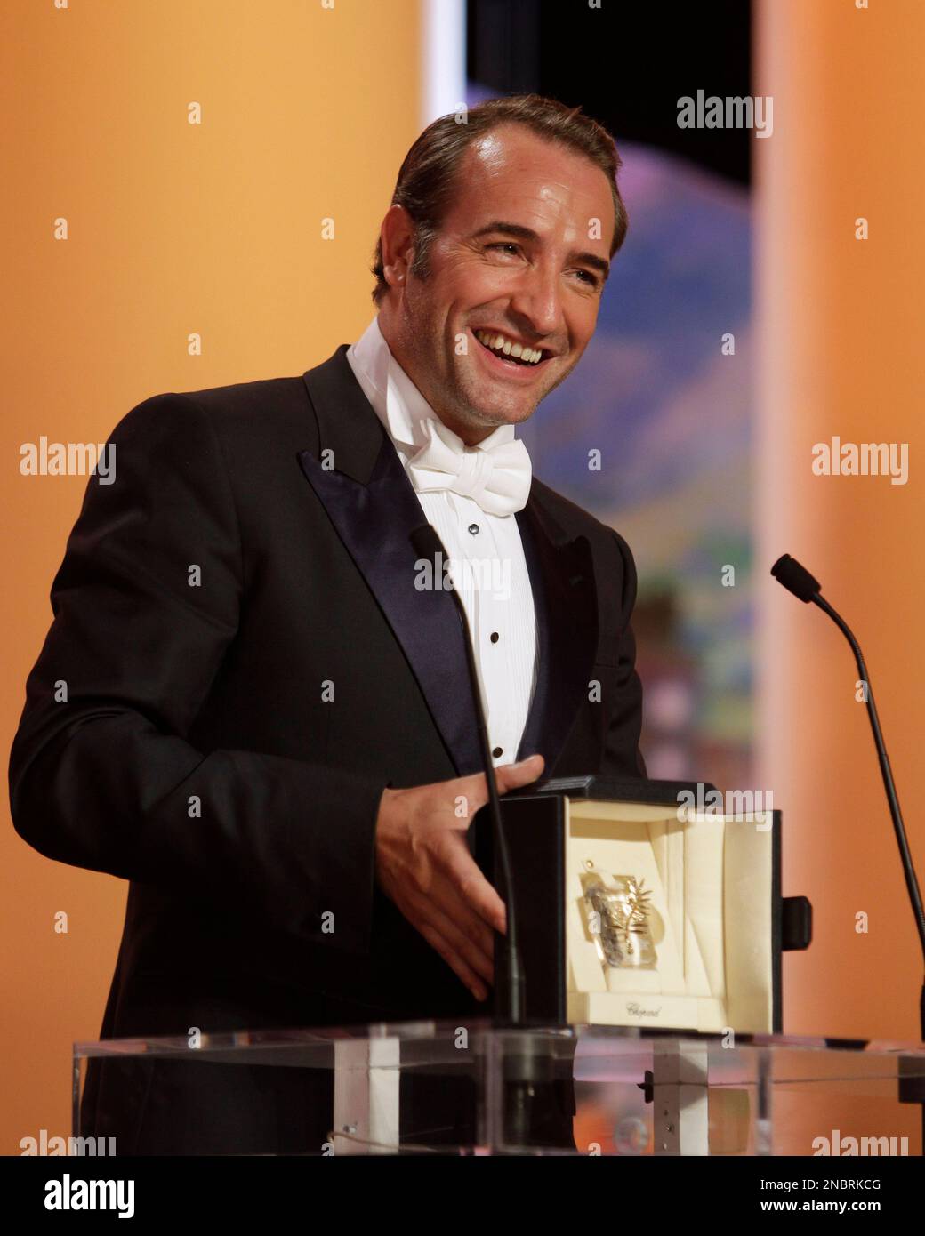 Actor Jean Dujardin poses with the Best Actor award for the film The ...