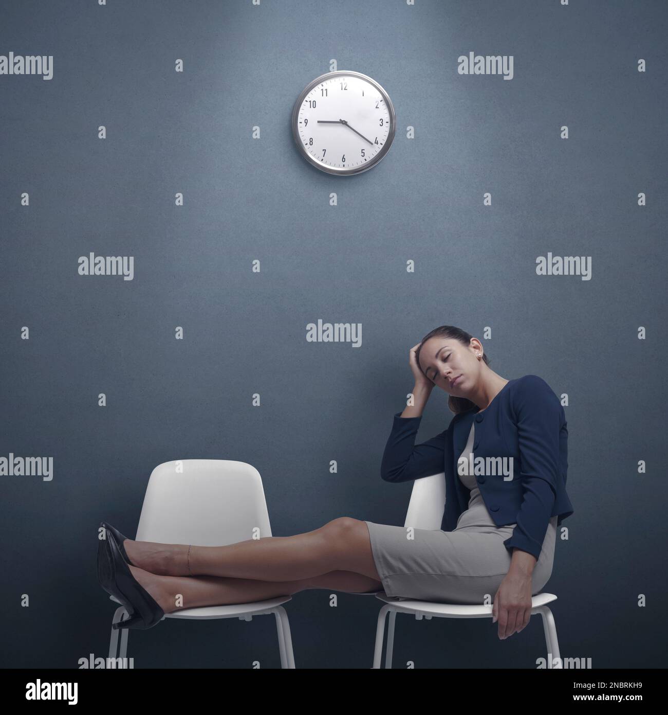 Exhausted young woman lying on chairs in the waiting room, she is ...