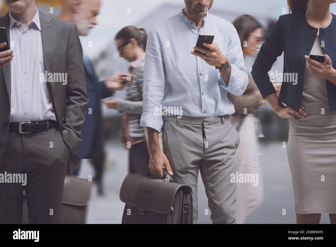 Crowd of distracted people walking in the city street and using ...