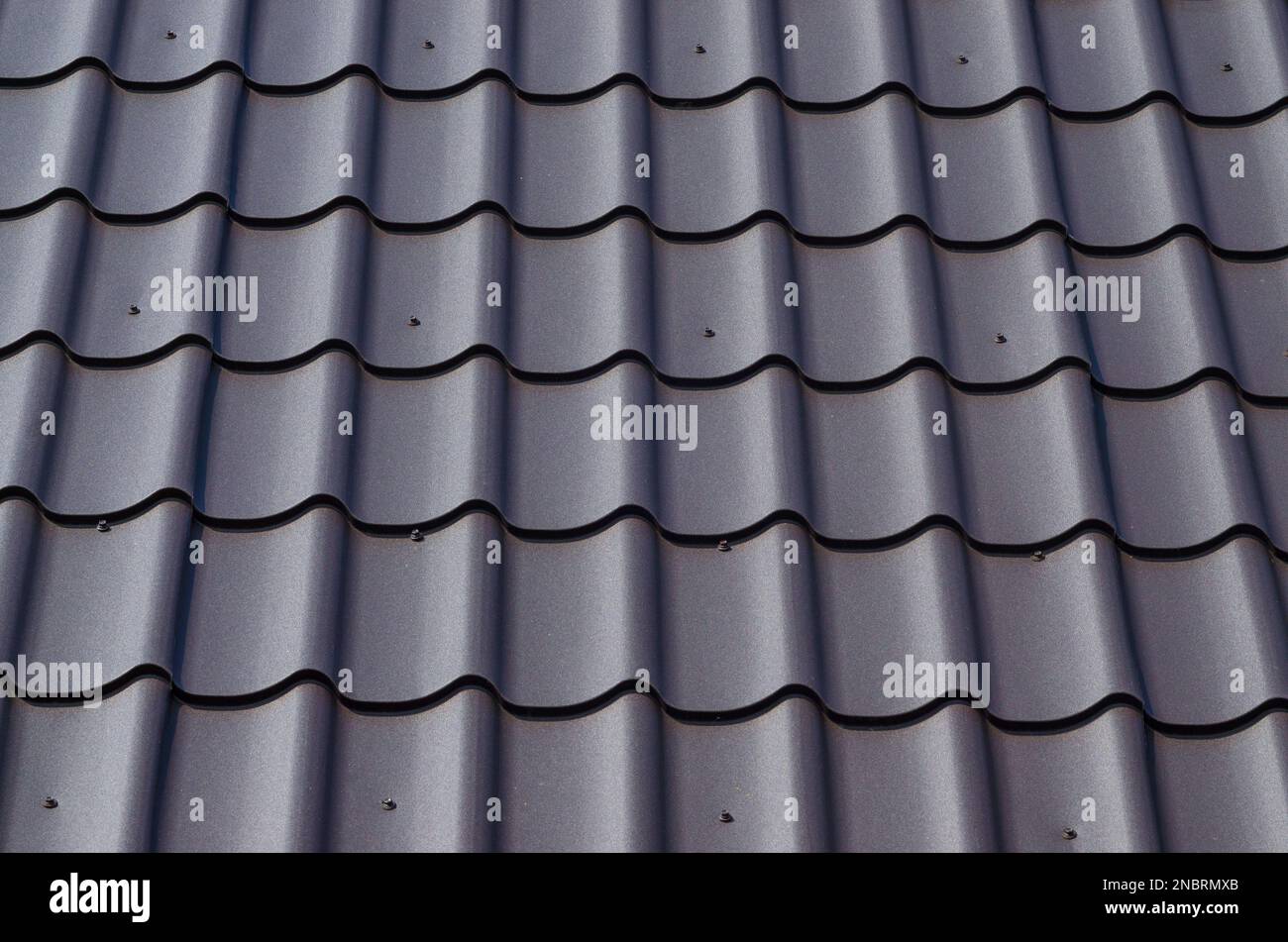 Slate roof as background. Metal tile roof surface, background, texture ...