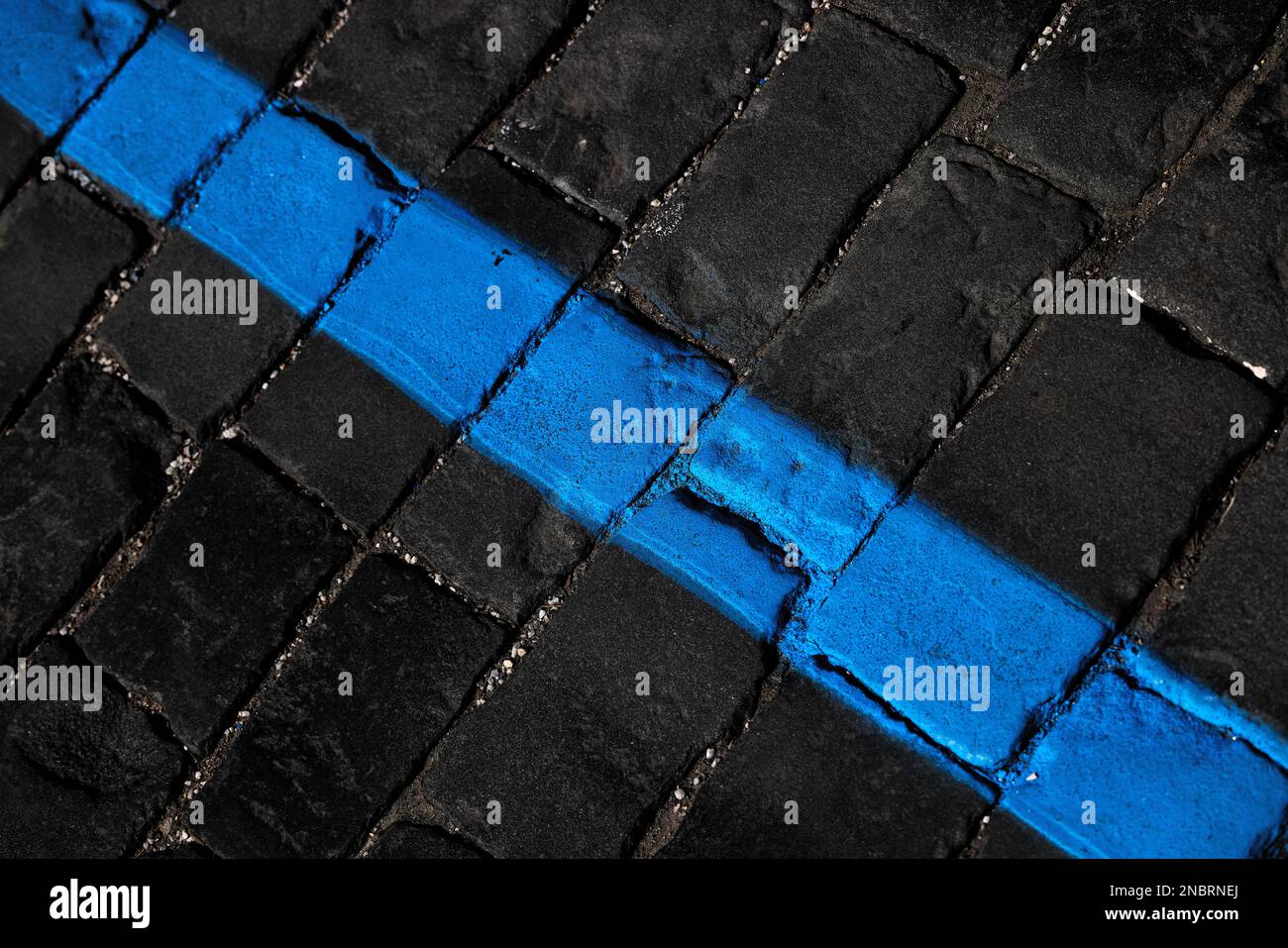 Road markings on the paving stones. The old road in the city. Historic ...