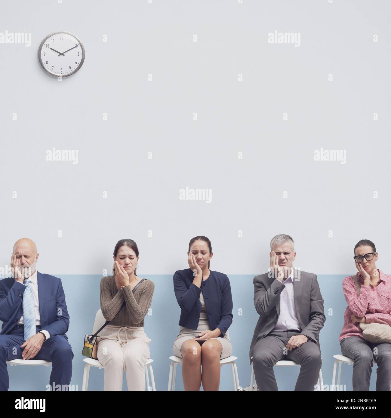 Diverse people sitting in the waiting room at the dental clinic, they ...