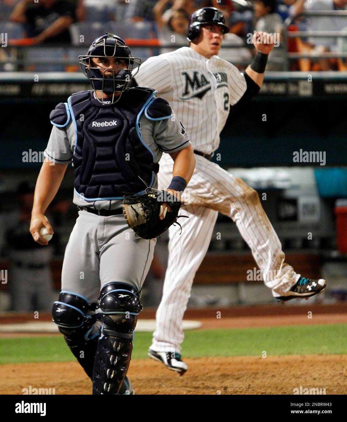 Florida Marlins runner Logan Morrison (20) celebrates after scoring in ...