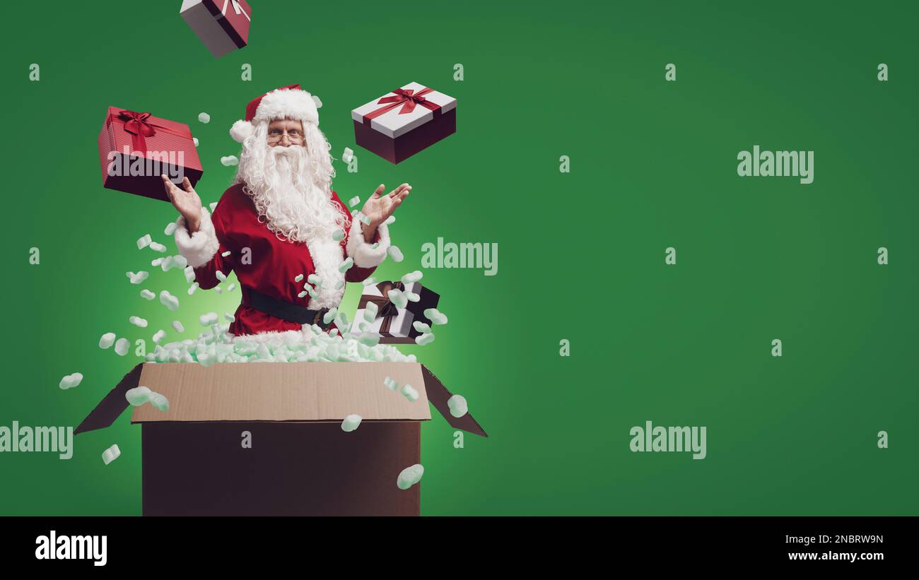 Cheerful santa delivering gifts hi-res stock photography and images - Alamy