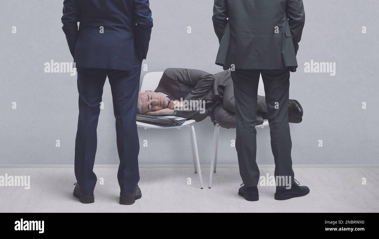 Exhausted lazy corporate businessman lying down on chairs and sleeping ...