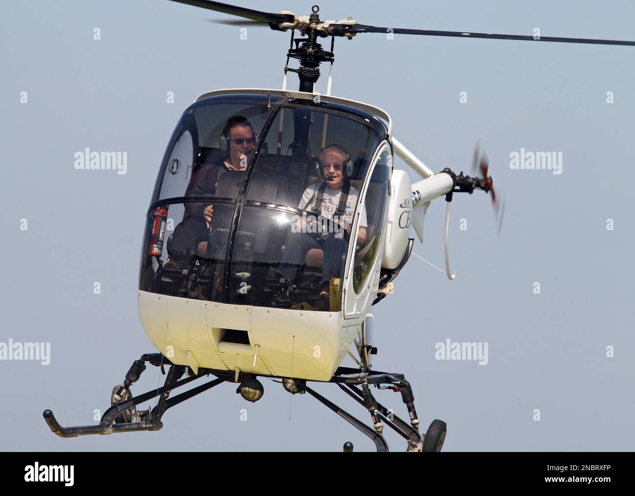 Pilot Jeff Fitch, left, lifts off with 87-year-old Leah Brenner for a ...