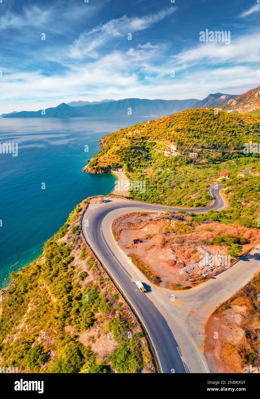 View from flying drone of zigzag road. Exciting summer scene of ...