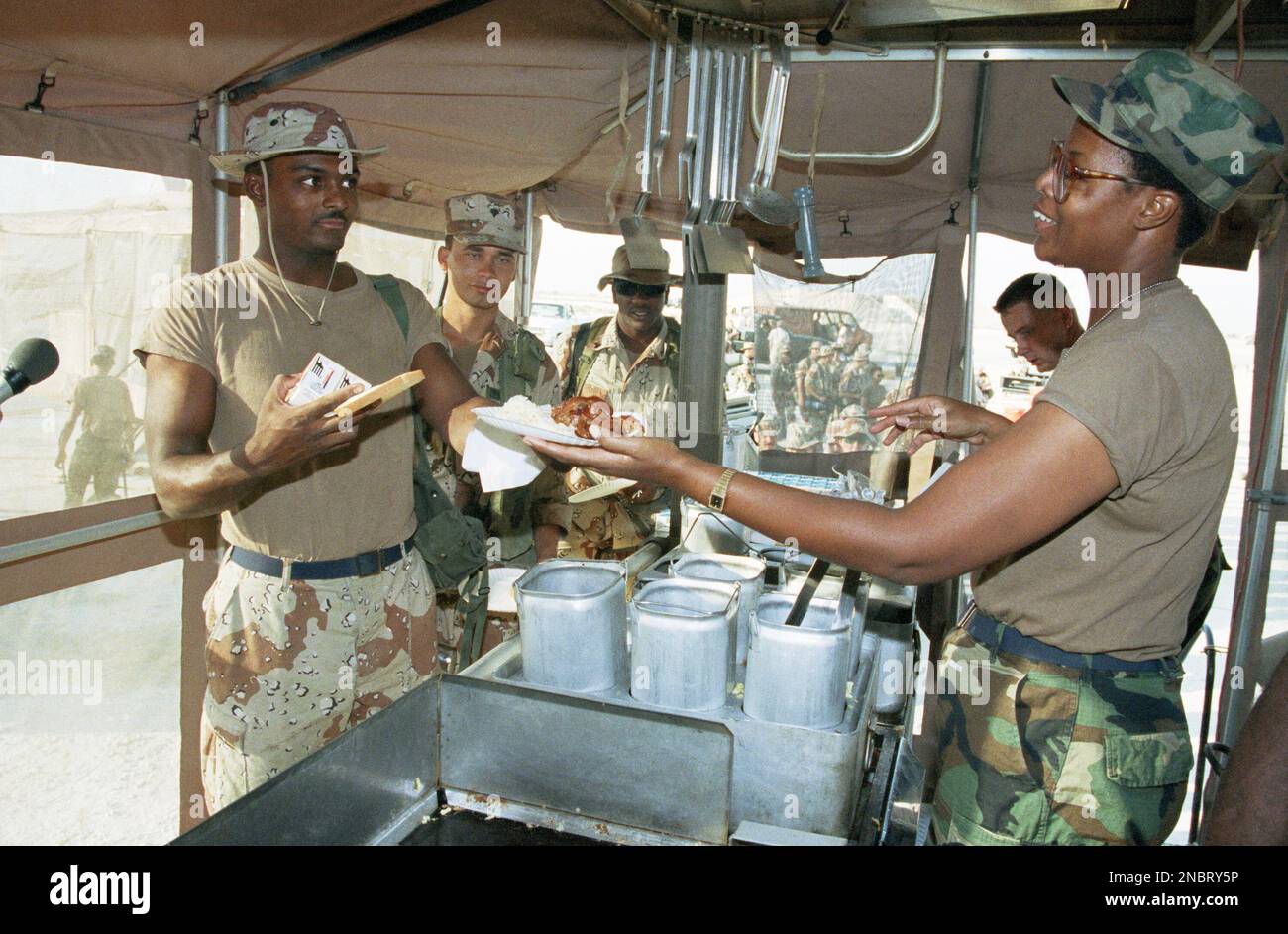 A U.S Air Force cook serves up an early morning breakfast on Wednesday ...