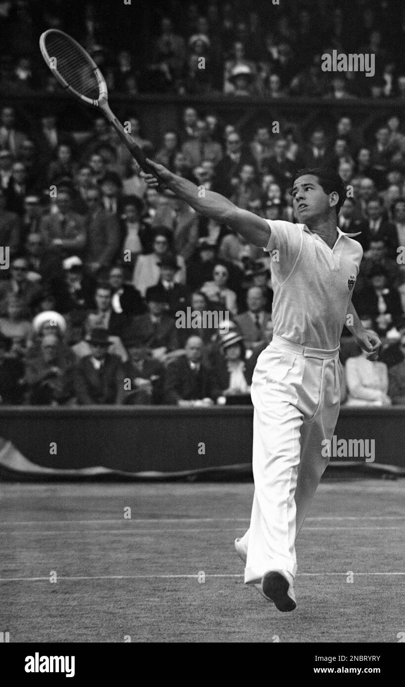 American tennis player Bobby Riggs, takes a high shot during his Centre ...