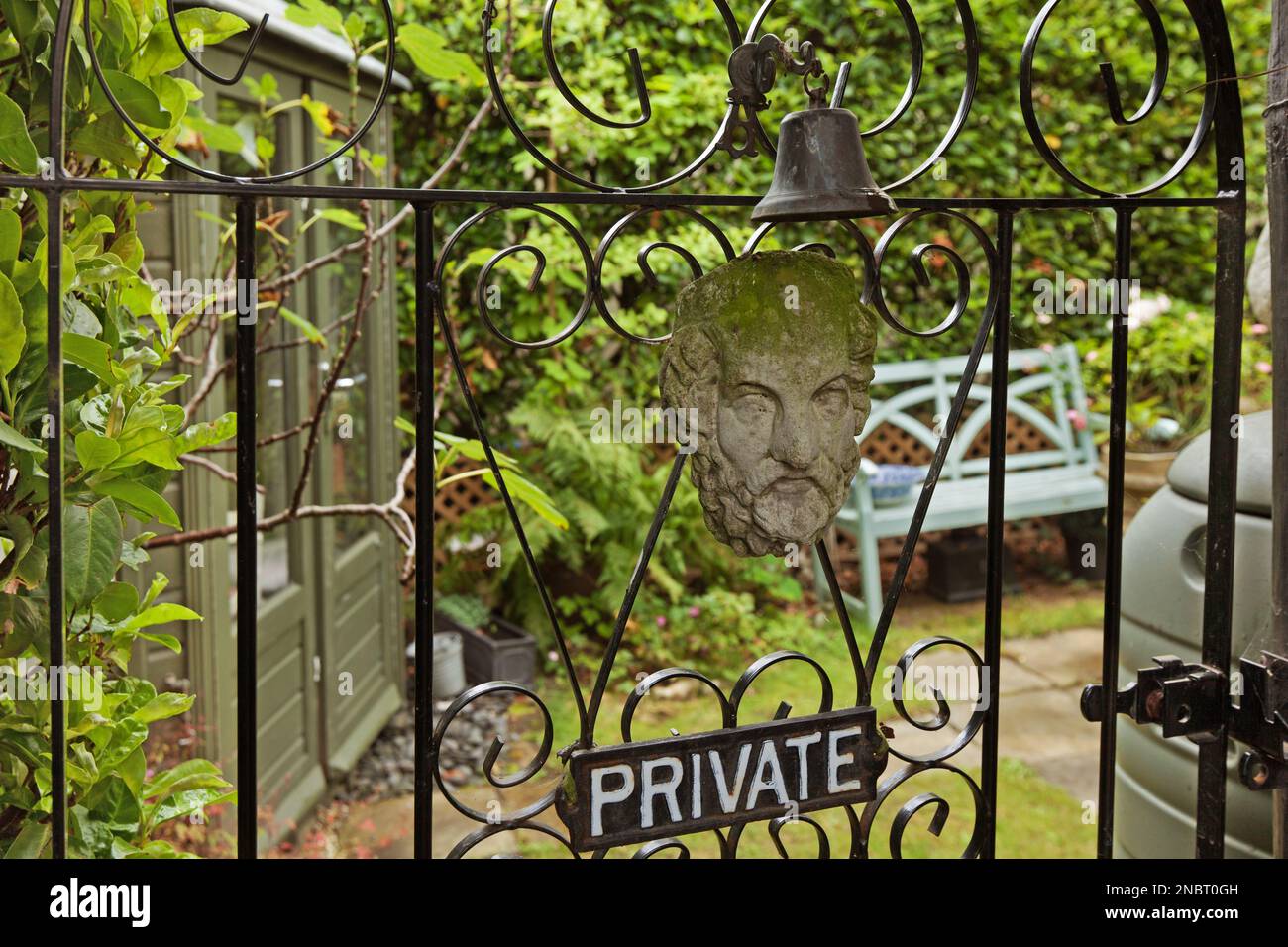 private sign on wrought iron gate to garden Stock Photo - Alamy