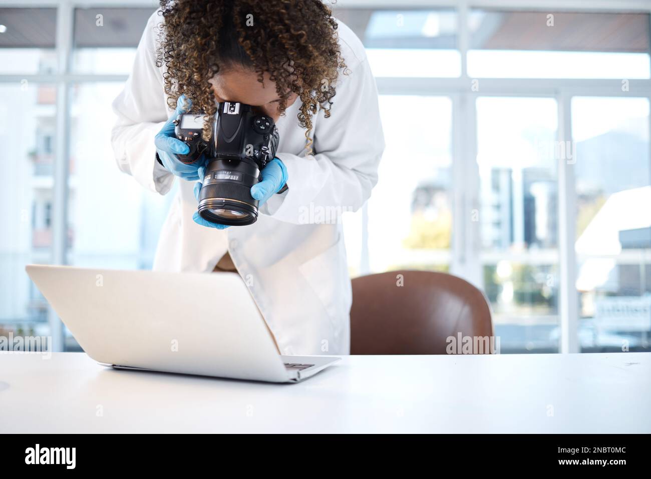 Science investigation, camera and black woman with laptop in laboratory ...