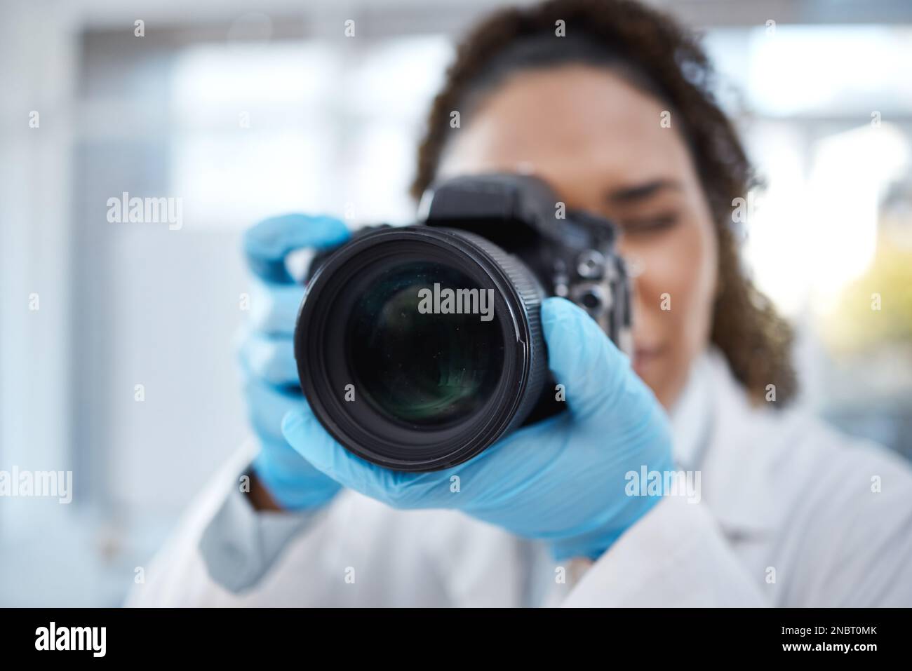 Camera, photography and lens with black woman in forensics laboratory ...
