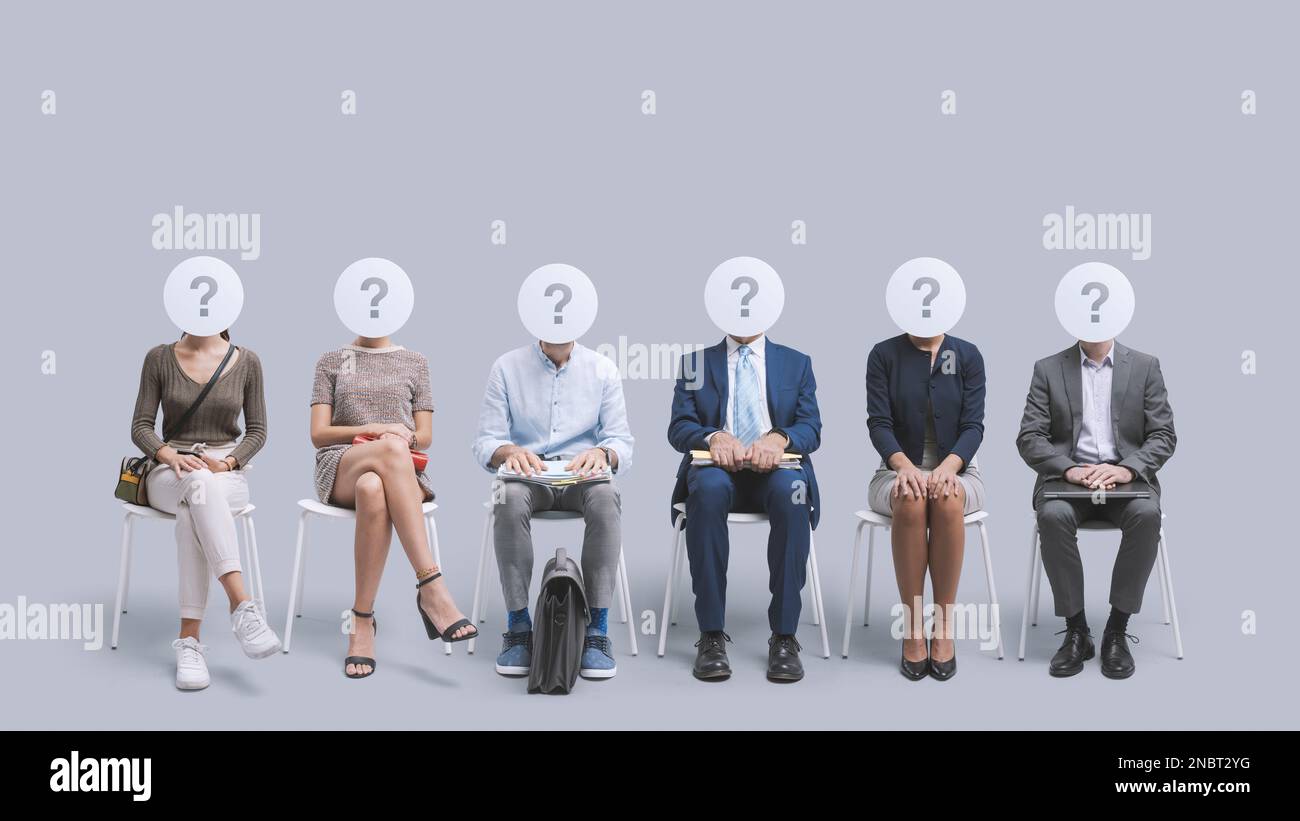 Diverse job candidates sitting in the waiting room and waiting for ...