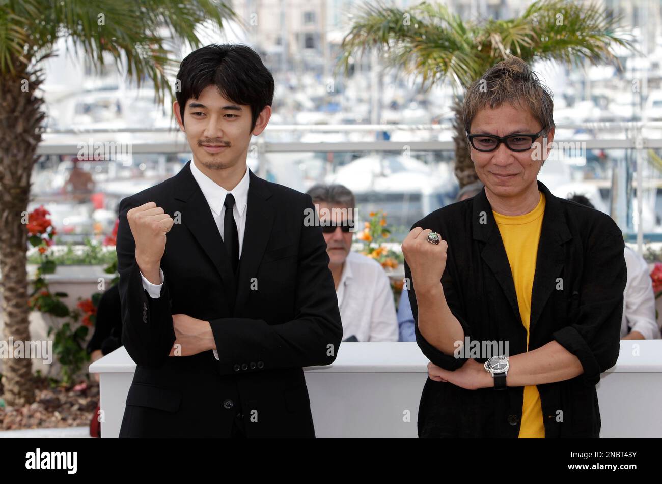 Actor Eita, left, and director Takashi Miike pose during a photo call ...