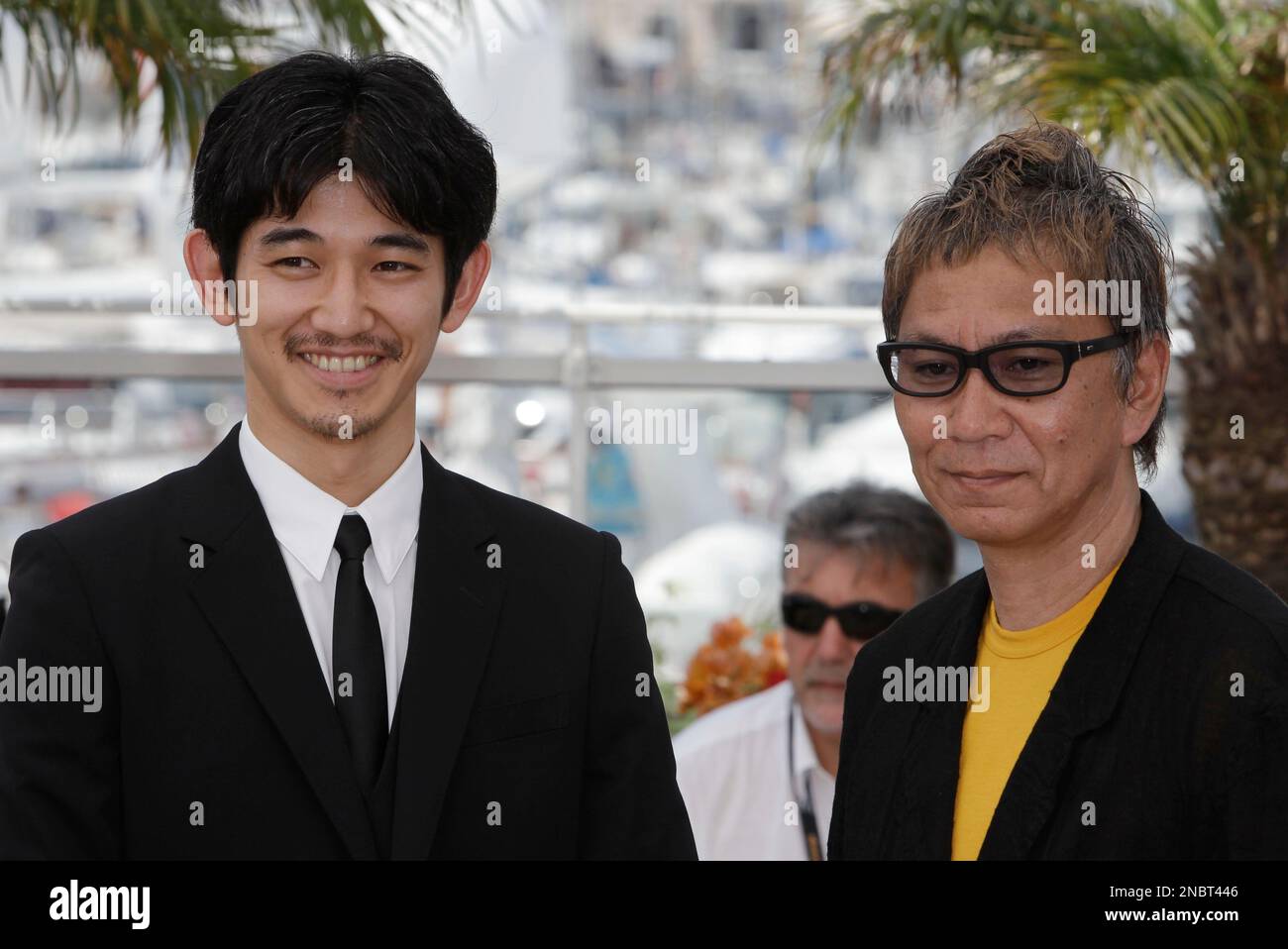Actor Eita, left, and director Takashi Miike pose during a photo call ...