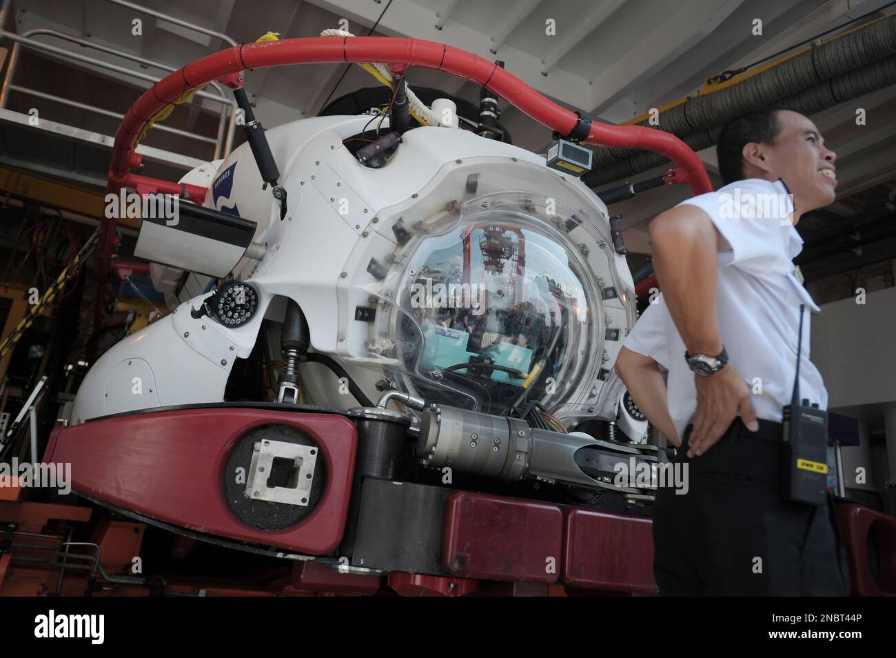 A Singapore naval officer stretches by a Submarine Rescue Vehicle on ...