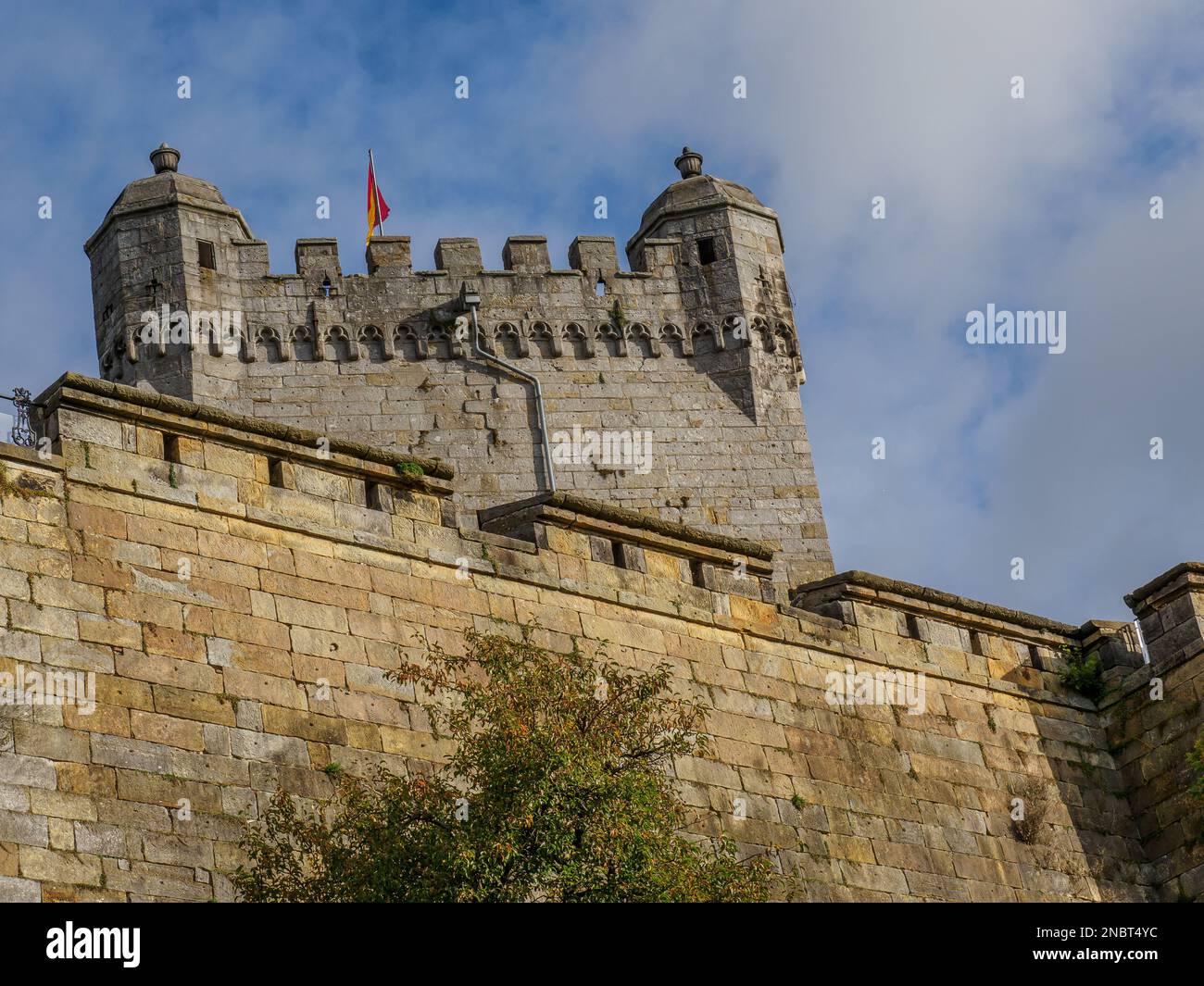 The ancient Bentheim Castle with a red flag waving atop a tower in Bad ...