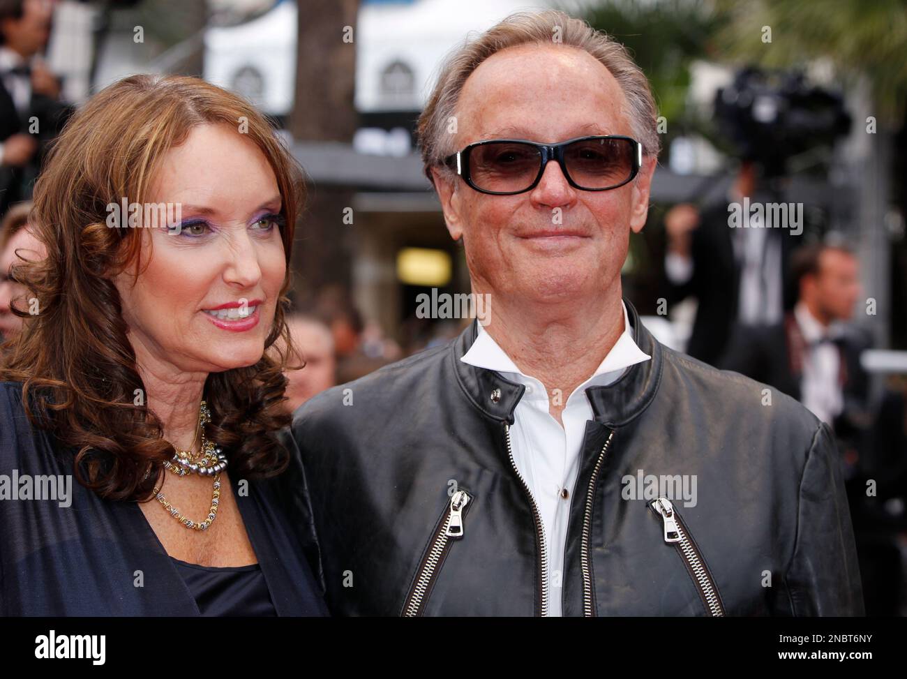 Actor Peter Fonda, right, arrives with his wife Portia Rebecca Crockett ...
