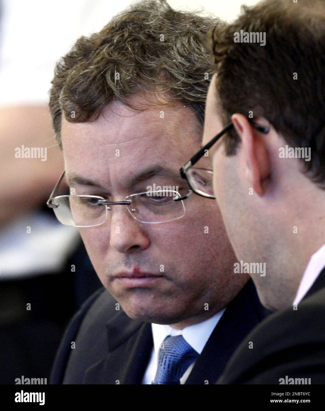 Defendant Mark Kerrigan, left, confers with defense attorney Hank ...