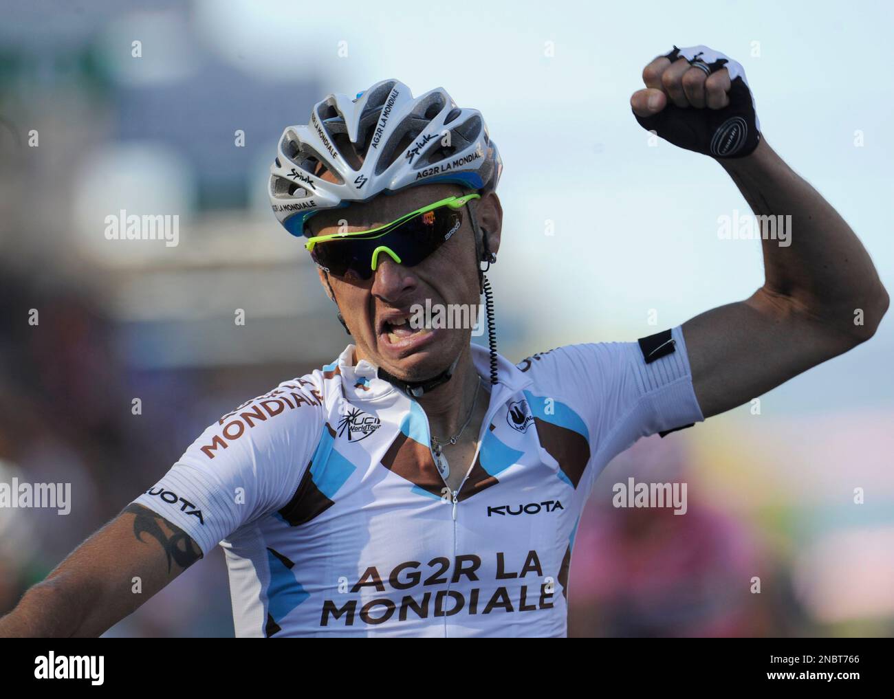 France's John Gadret reacts as he crosses the finish line to win the ...