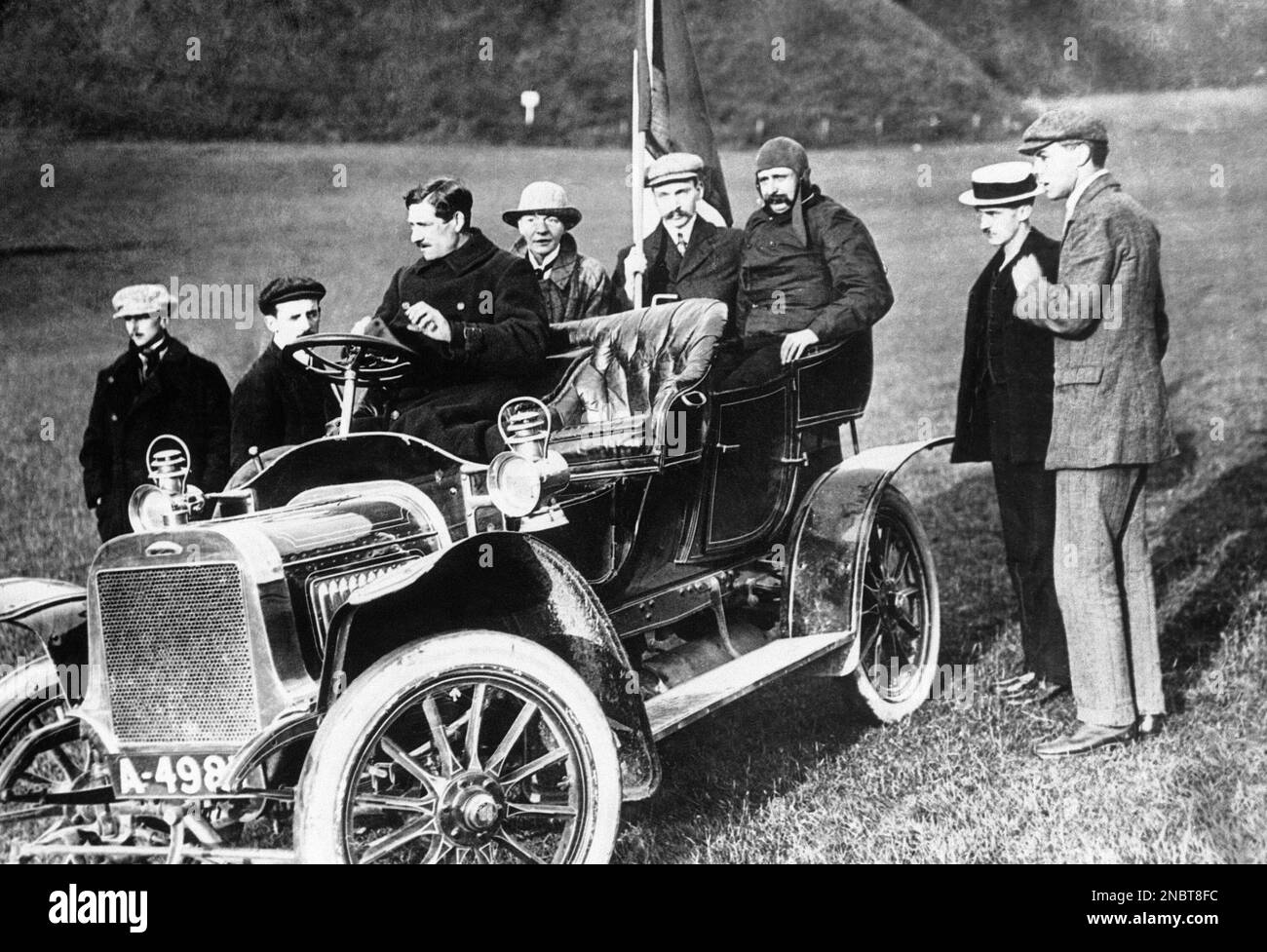 French aviator Louis Bleriot, in flying kit sitting in the back seat ...