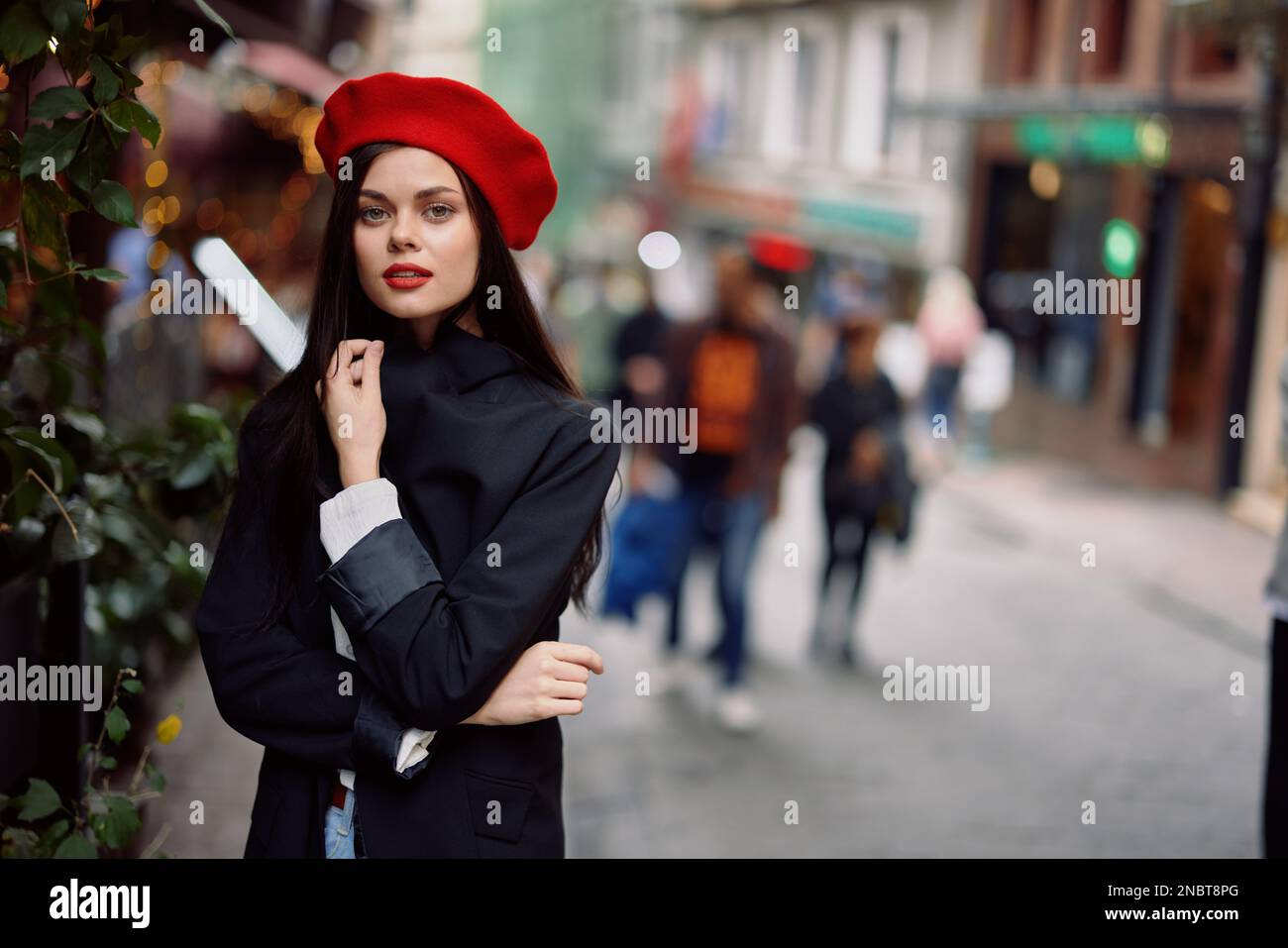 Woman walking down an old city street in a crowd, sociophobia, fear of ...