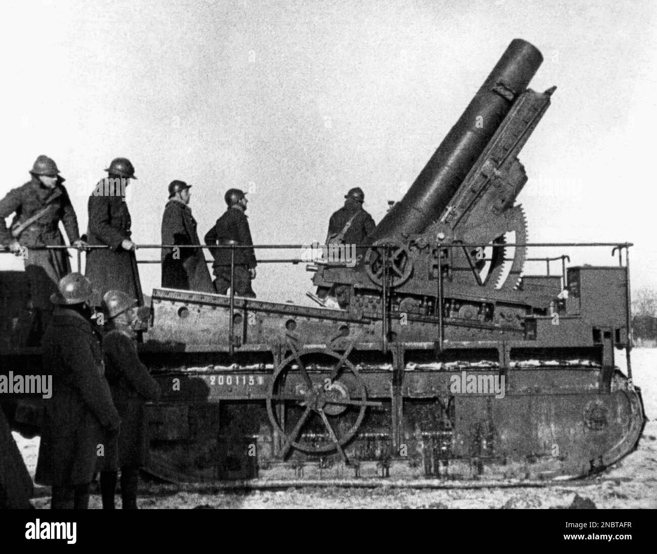 With muzzle pointing skyward, this French 280mm Howitzer, mounted on a ...