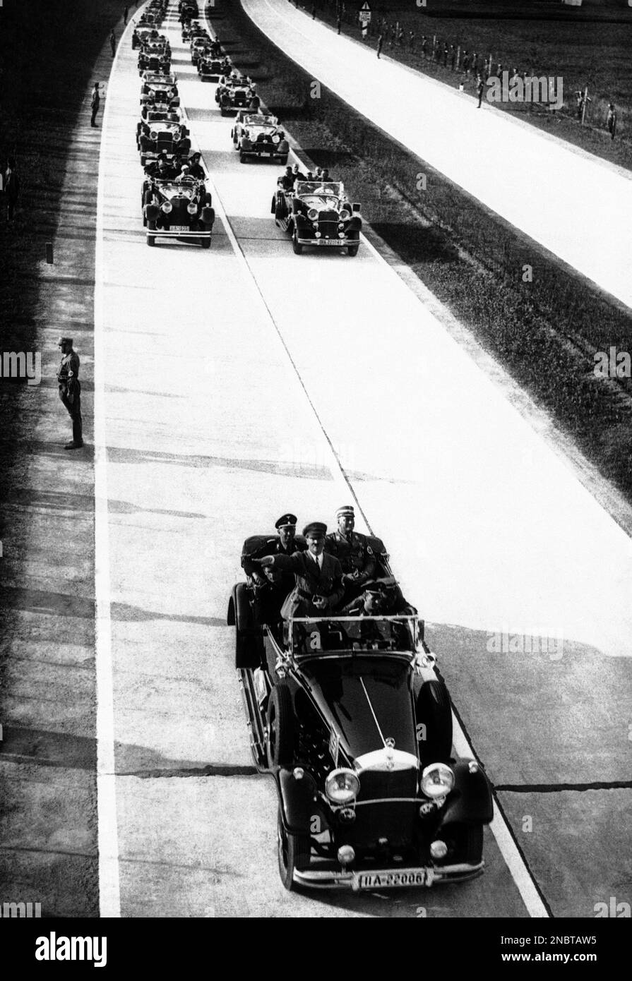 German Chancellor Adolf Hitler, riding in the first car inaugurates the ...