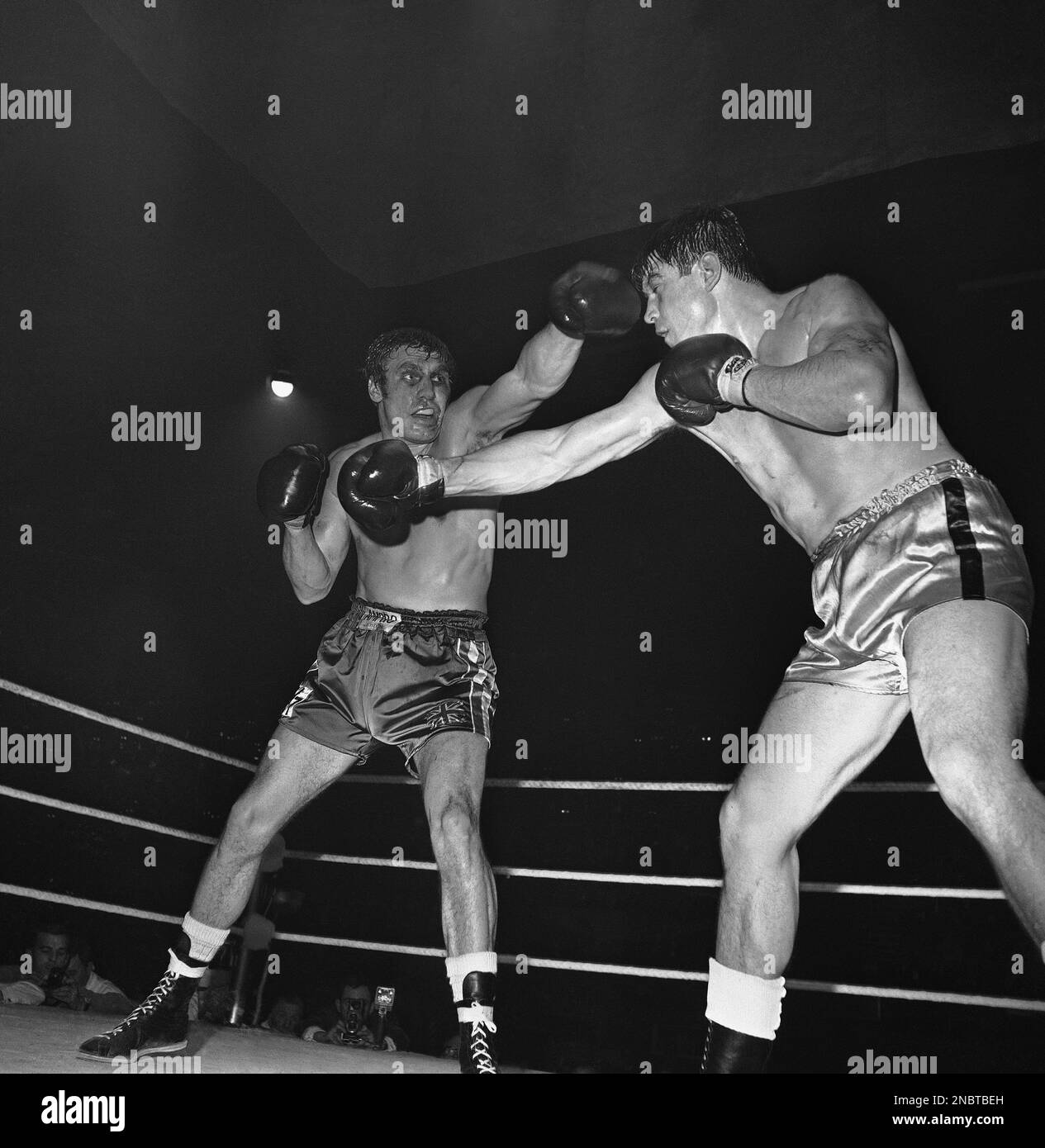 British Heavyweight, Billy Walker, left, exchanges lefts with Germany’s ...