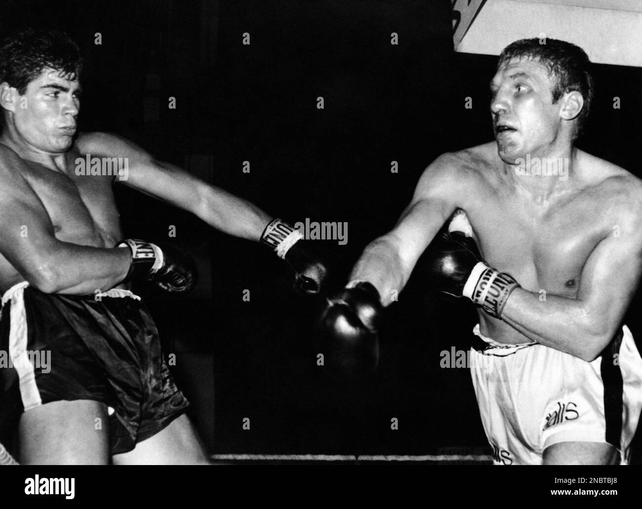 Eduardo Corletti, left, Argentinian heavyweight boxer, avoids a right ...