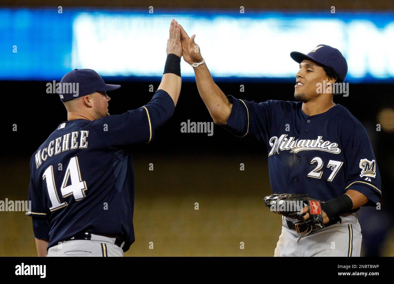 Milwaukee Brewers third baseman Casey McGehee, left, and center fielder ...