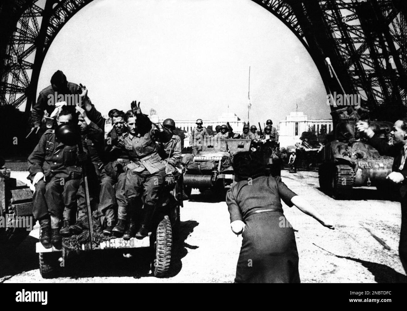 Nazi prisoners shrink from jeering Parisians as they are driven under ...