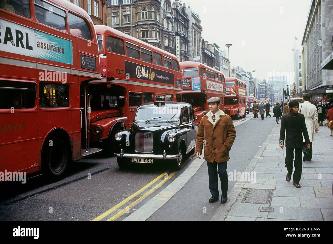 London 1972. A street view of Oxford street with the traffic passing ...
