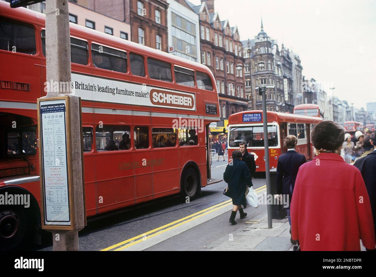 London 1972. A street view of Oxford street with the traffic passing ...