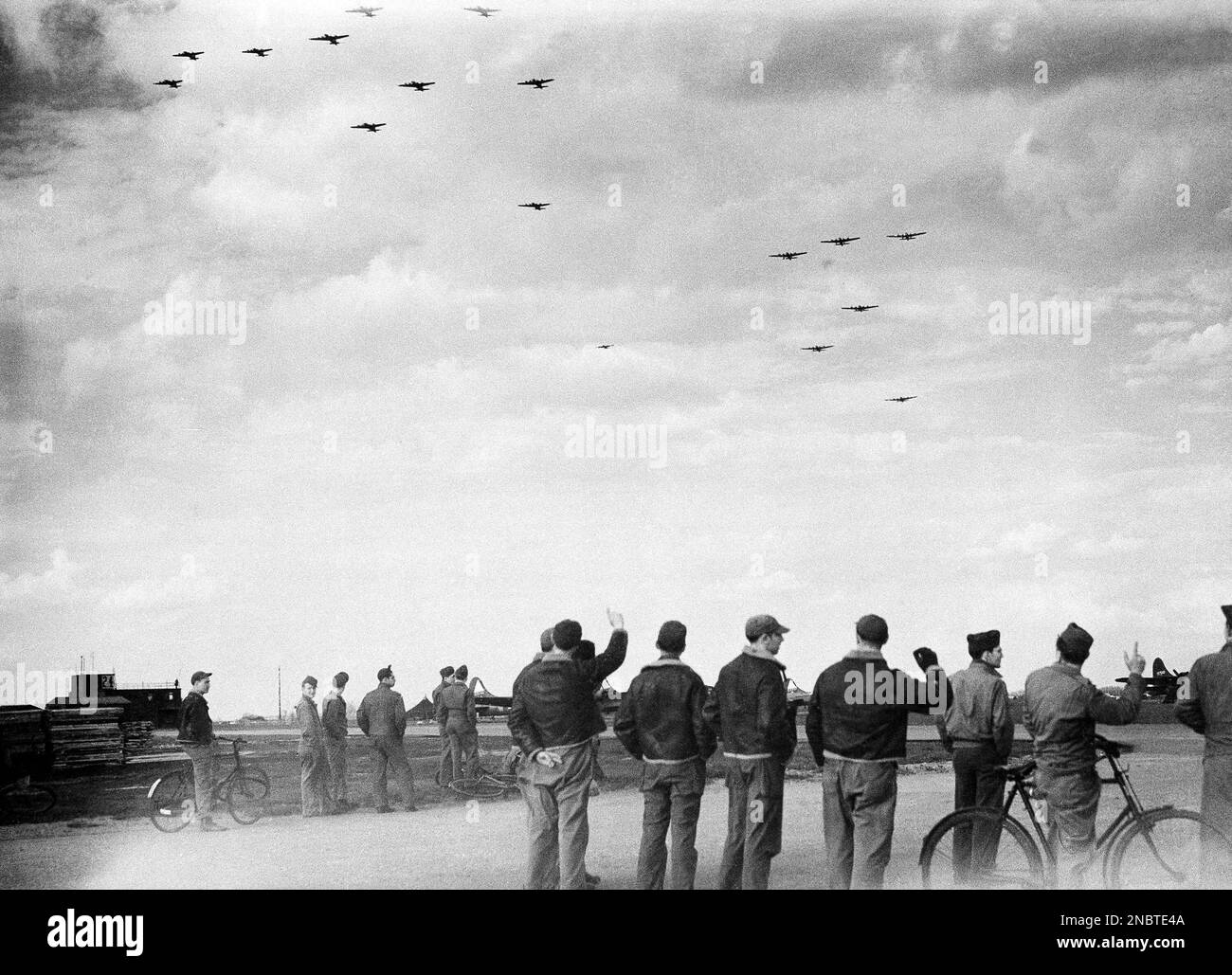 Men at a U.S. Army Air Force base in England, on April 19, 1944, watch ...