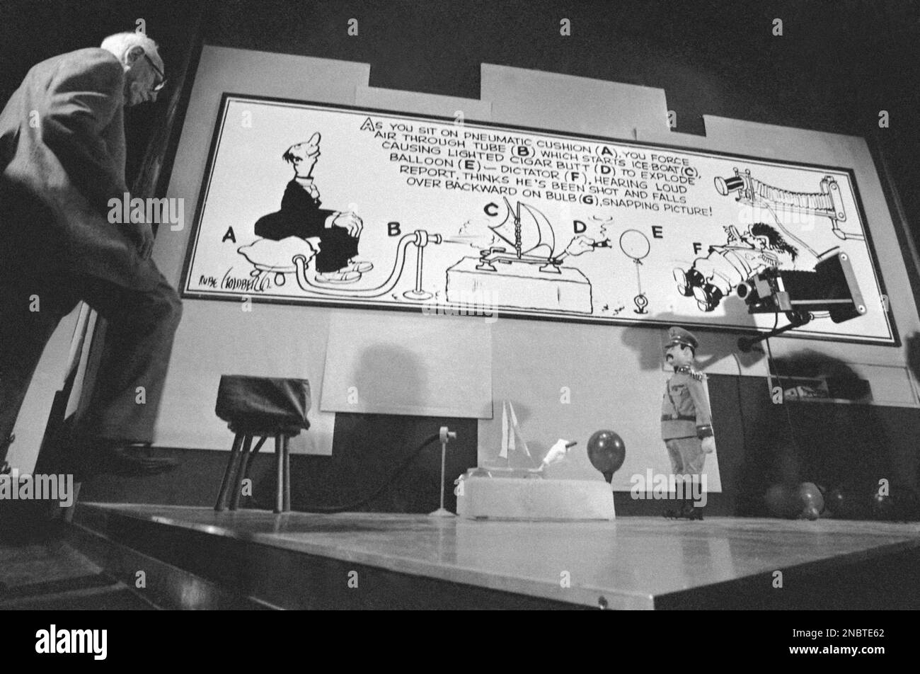 Inventor and cartoonist Rube Goldberg, 87, demonstrates his picture ...
