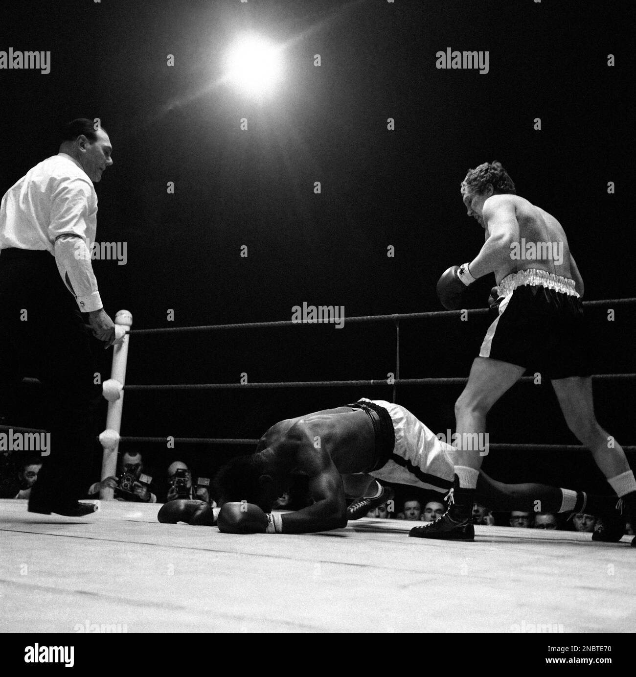 Billy Walker, 25-year-old British heavyweight boxer, stands over fallen ...