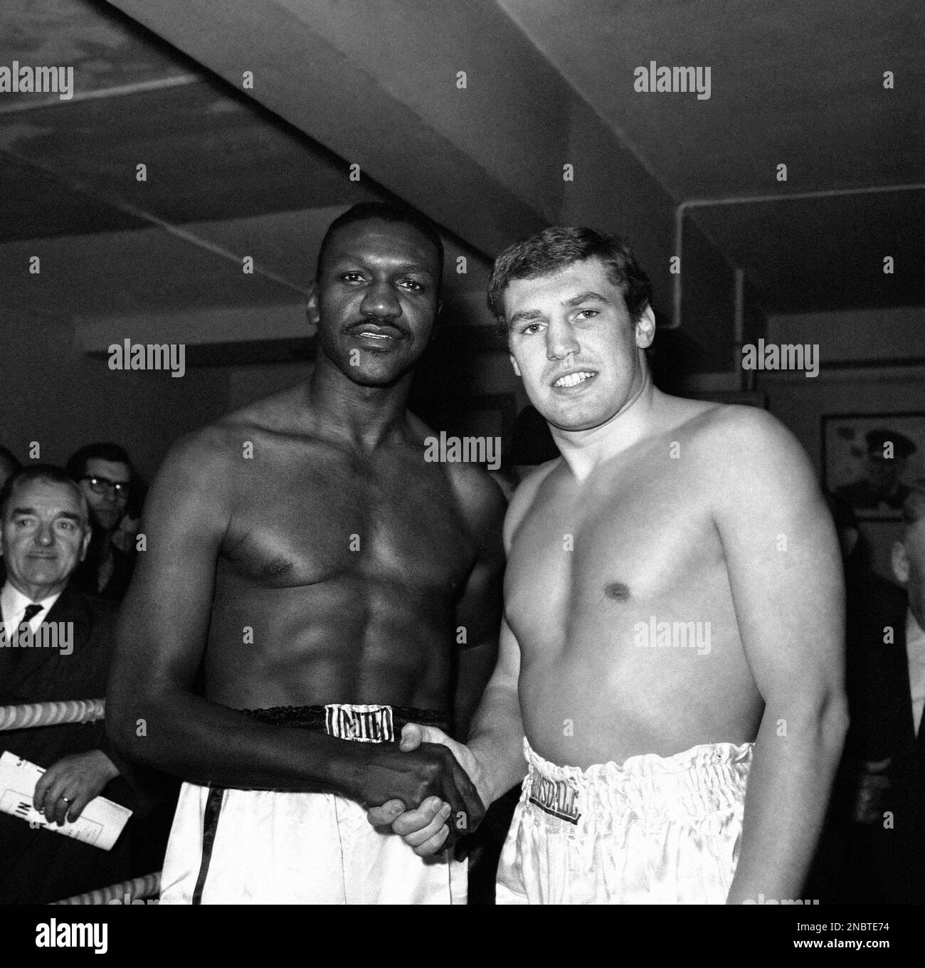 Billy Walker, the golden boy of British boxing, right, shakes hands ...