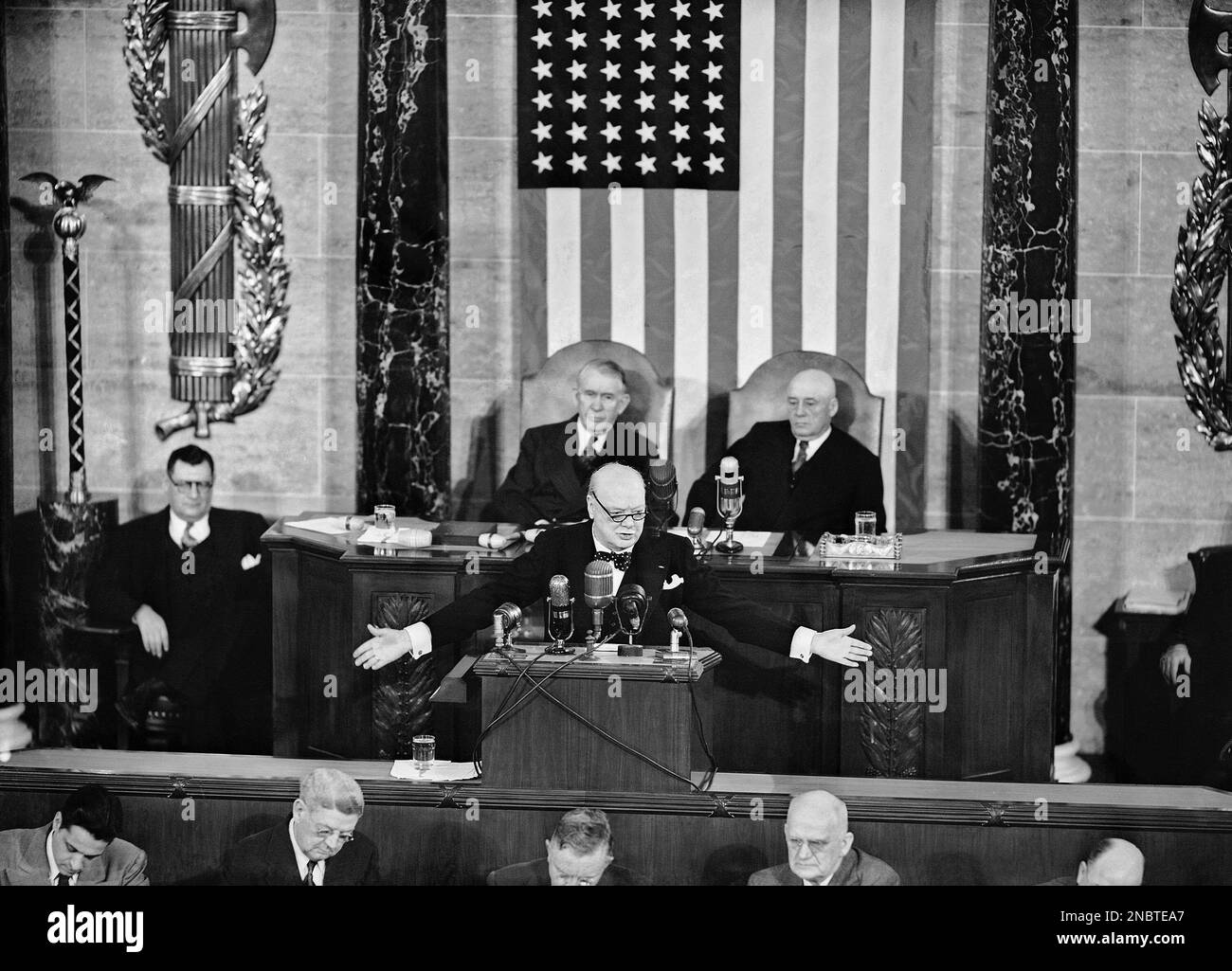 British Prime Minister Winston Churchill spreads his arms wide as he ...