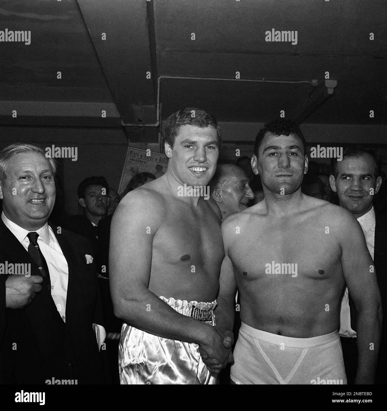 British boxers Billy Walker, left, and Joe Erskine shake hands after ...