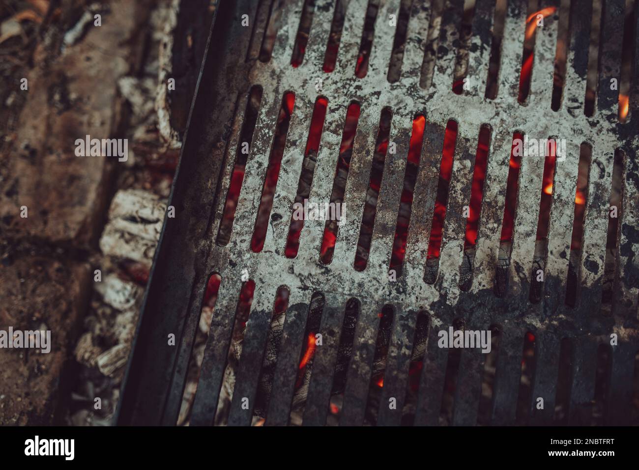 Empty flaming charcoal grill with open fire, ready for product ...