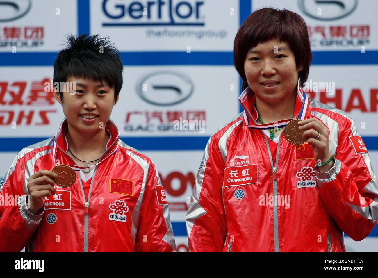 China's Li Xiaoxia, right, and Guo Yue, left, show their gold medals on ...