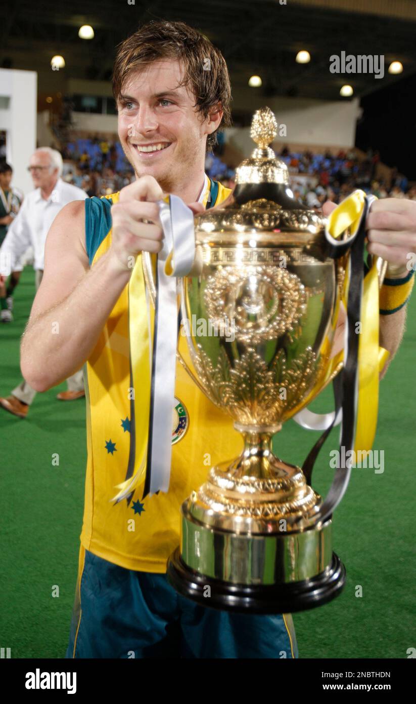 Australia's team captain Fergus Kavanagh poses with the trophy after ...